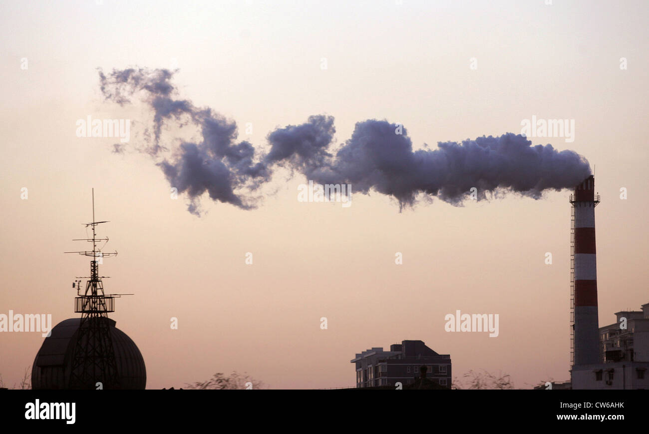 Symbol photo, smoky factory chimney Stock Photo - Alamy