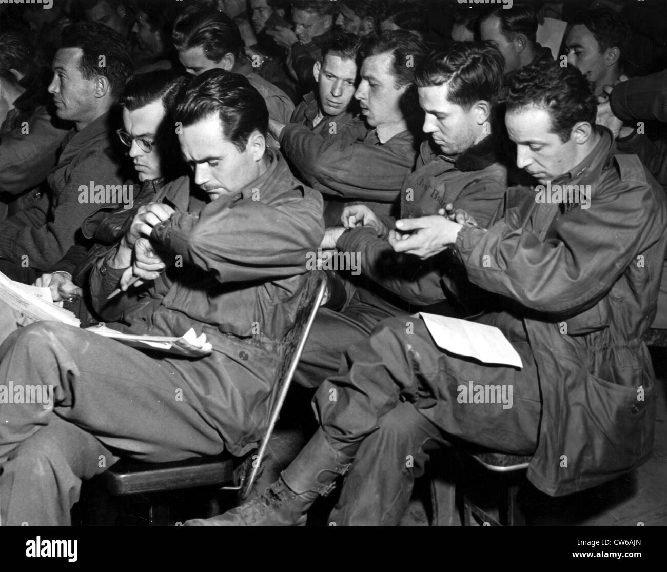 U.S Troop Carrier Group soldiers synchronize their watches (March 24 ...