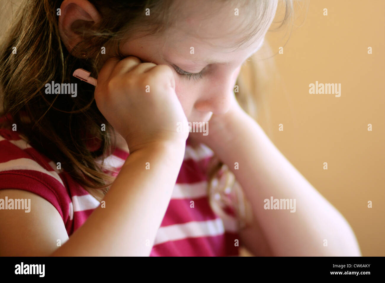 young girl concentrating Stock Photo - Alamy