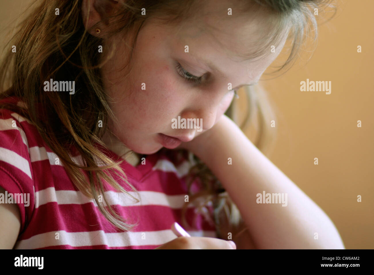 young girl concentrating Stock Photo - Alamy
