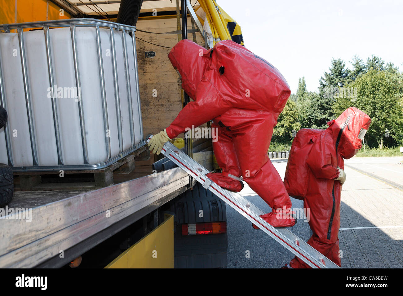 fire service drill at transport of hazardous goods, firefighter save ...