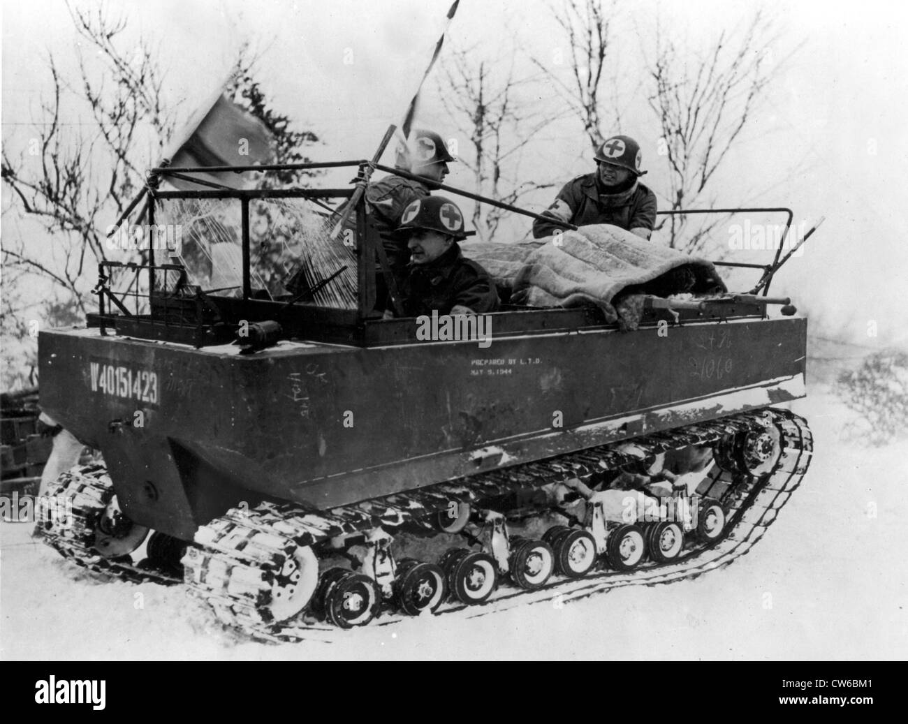 U.S medical corpsmen remove casualty on tractor ambulance in Germany ...