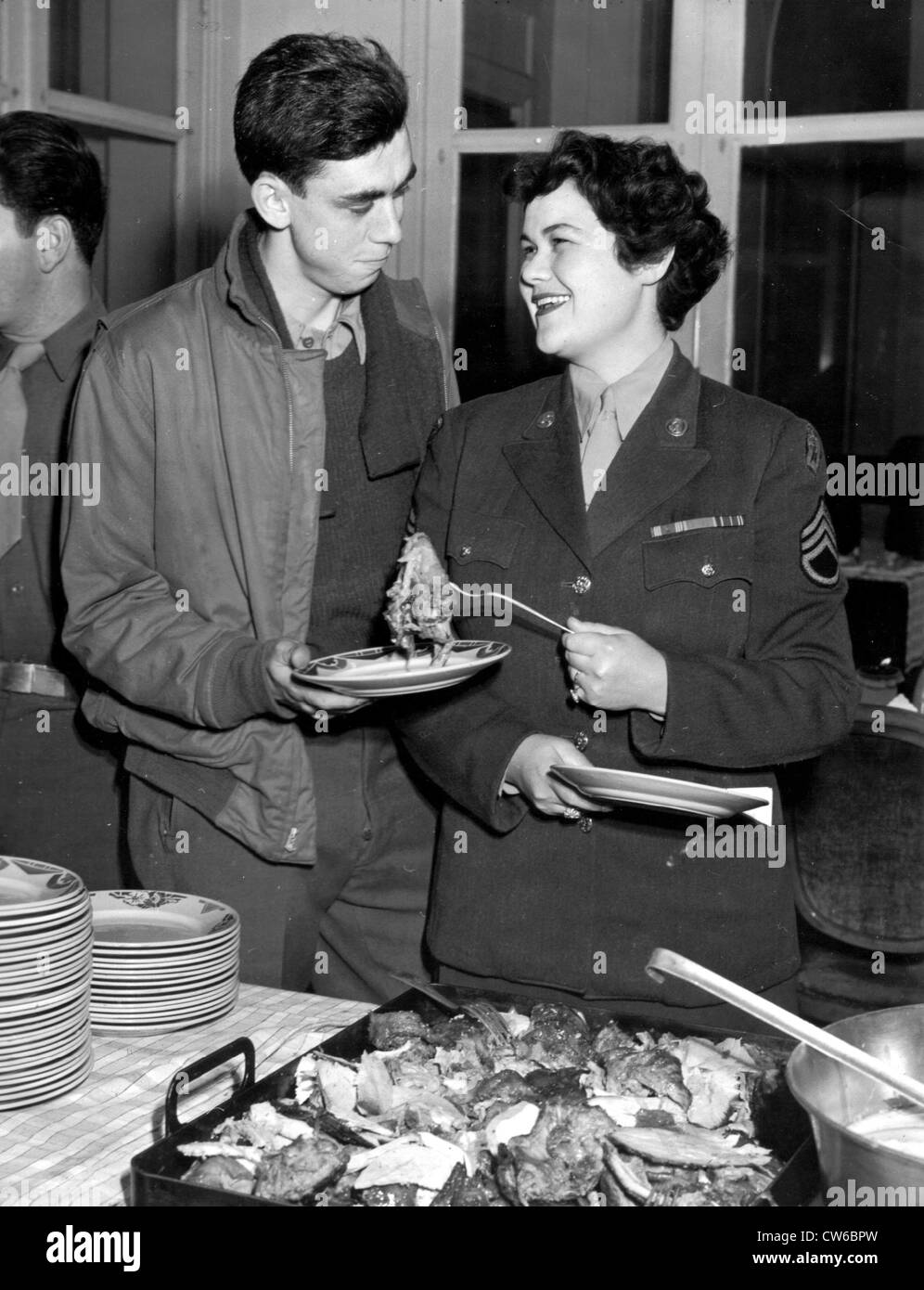 A U.S soldier and a WAC at a Thanksgiving dinner (Nov. 23,1944) in ...