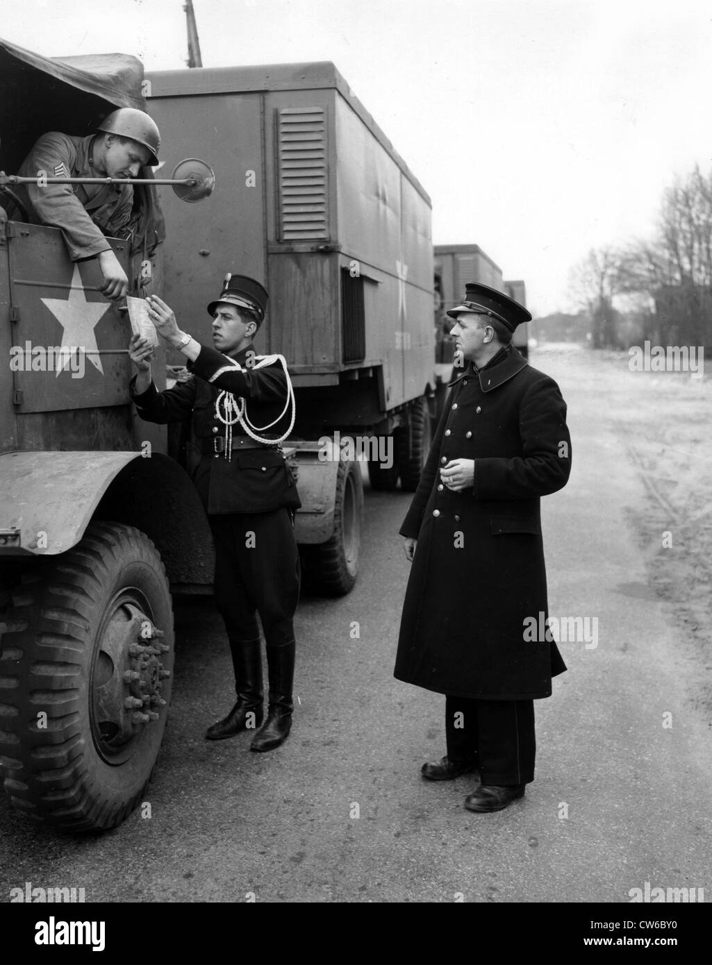 A U.S Army driver has his papers checked by a Dutch border guard near ...