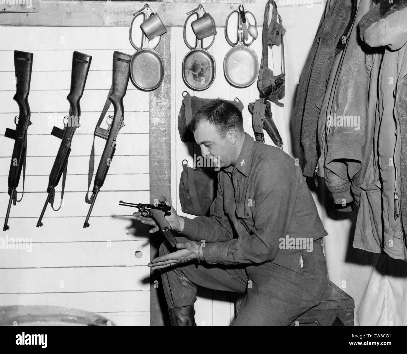 A U.S . Air Force Lieutenant inspect a captured German Luger pistol in ...
