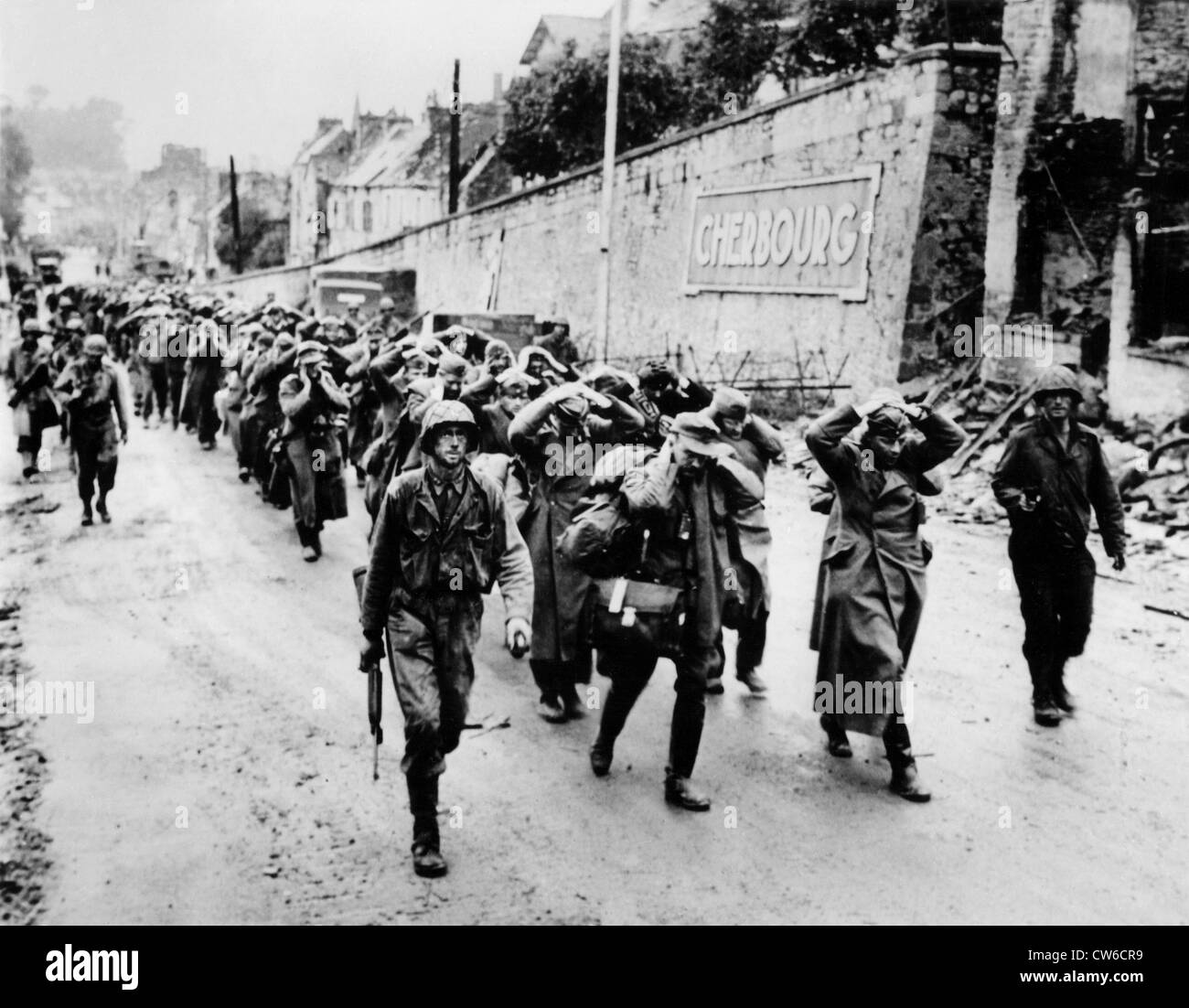 Germans prisoners march through streets of Cherbourg, June 27, 1944 ...