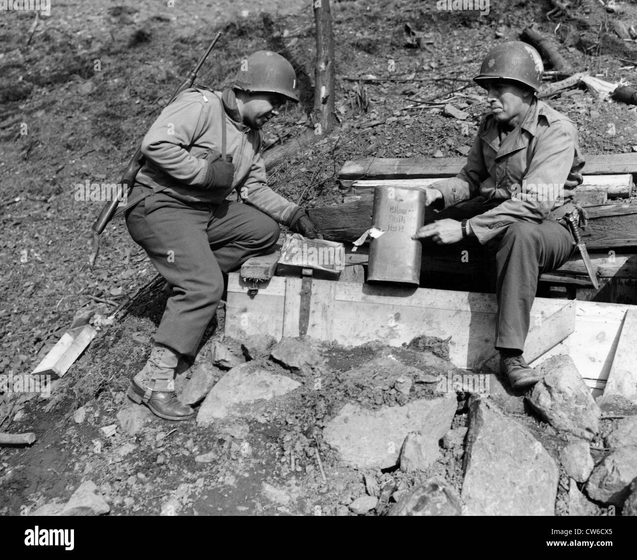 U.S. engineers examine German demolition charge at Remagen bridge ...