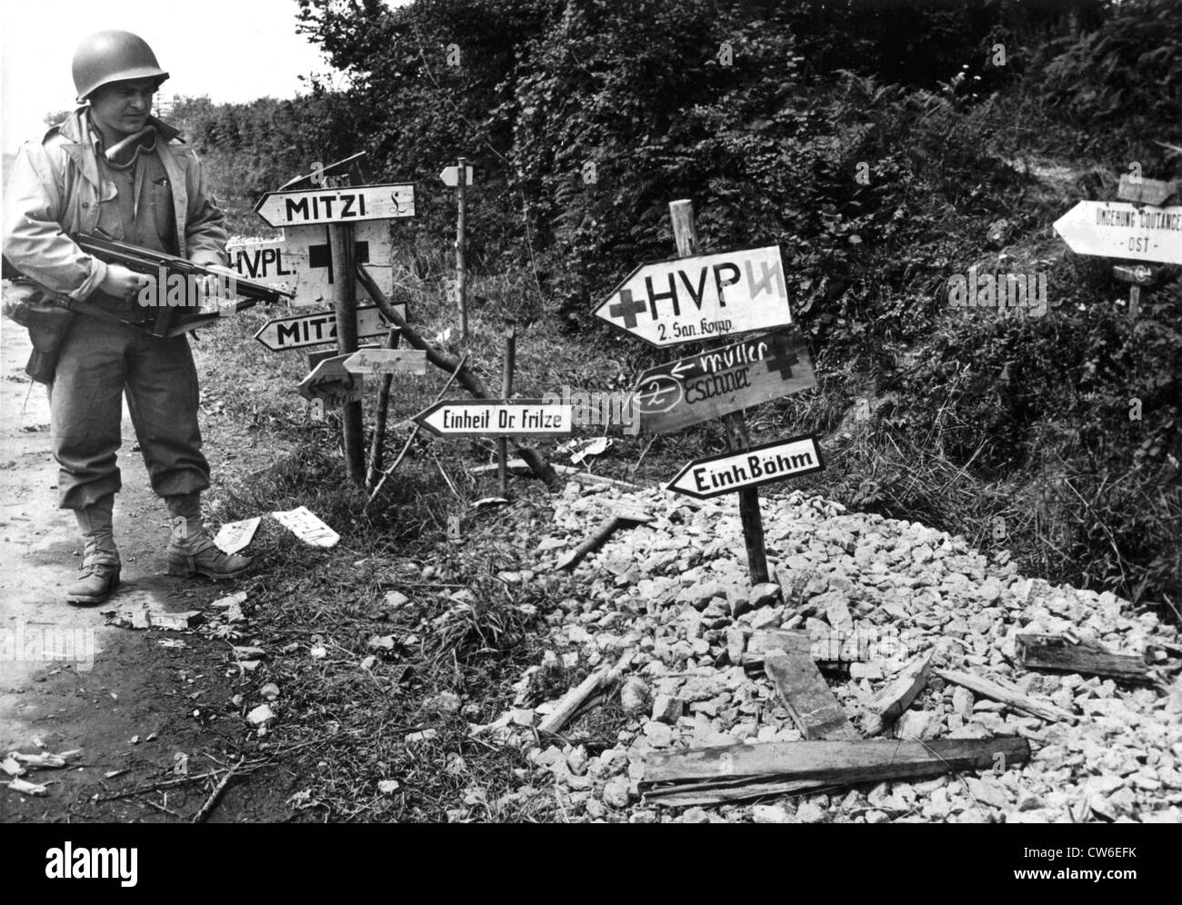 American soldier with German signs in Normandy, July 1944 Stock Photo ...