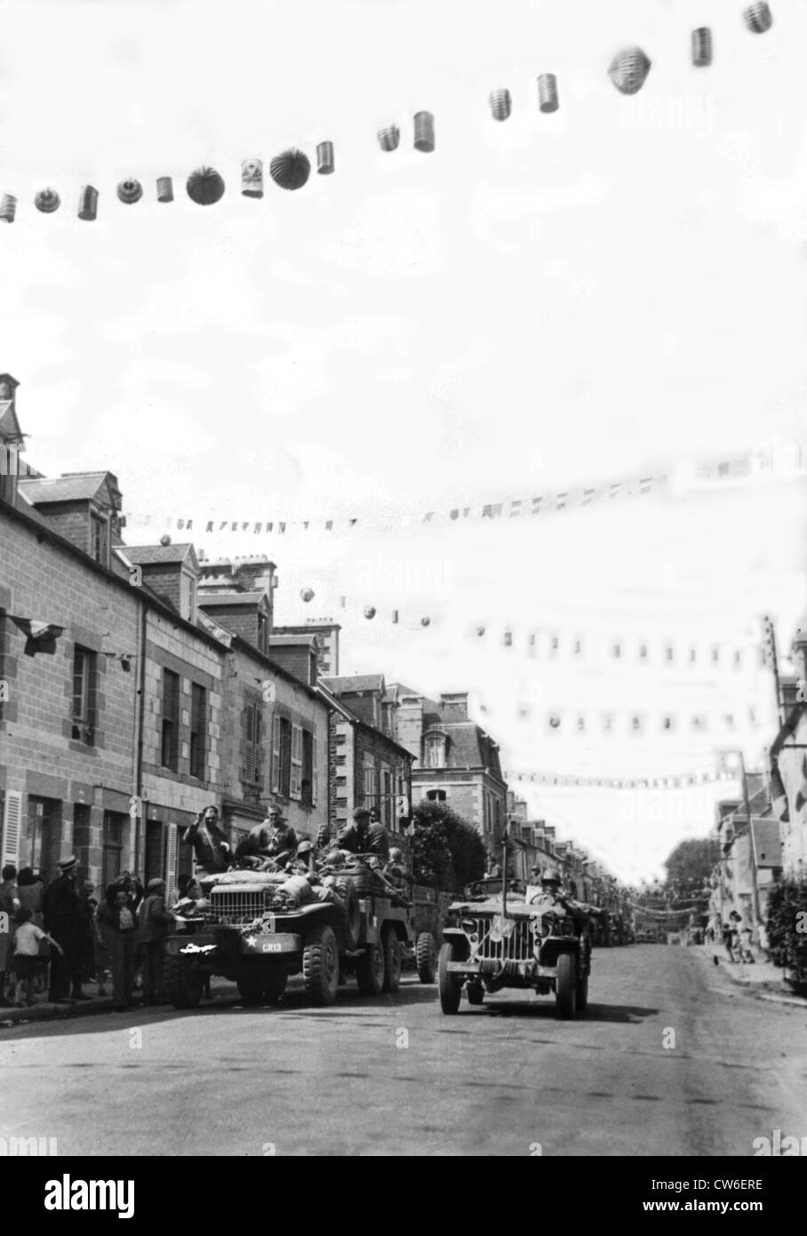 French civilians welcome U.S. troops in Fougeres, Summer 1944 Stock ...