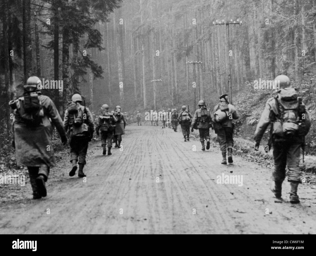 American soldiers advance in the misty Meurthe Valley, November 1944 ...