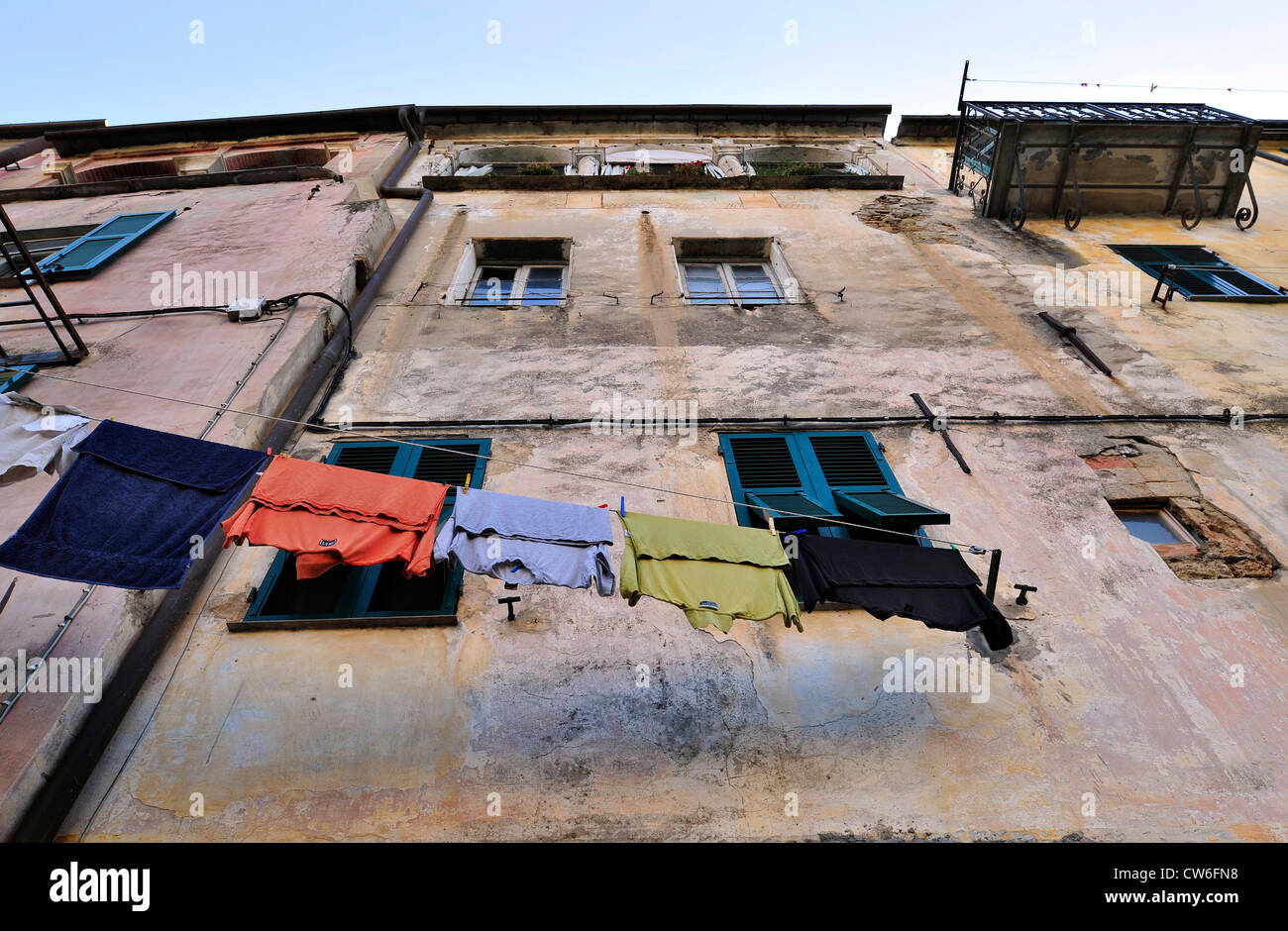 cladding and clothes hanging on a clothesline, Italy, Liguria, Riviera ...