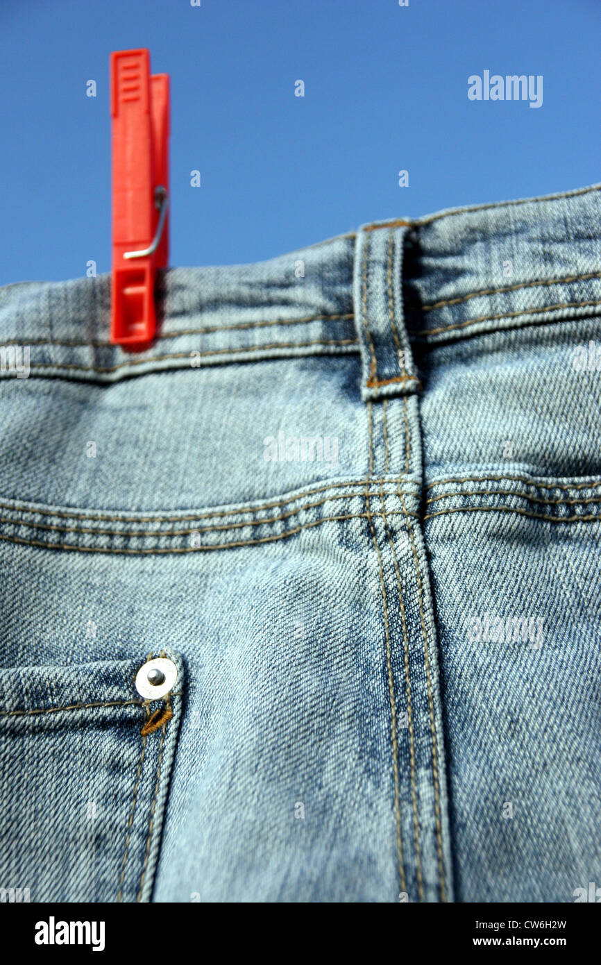 jeans drying on a clothesline outside Stock Photo - Alamy