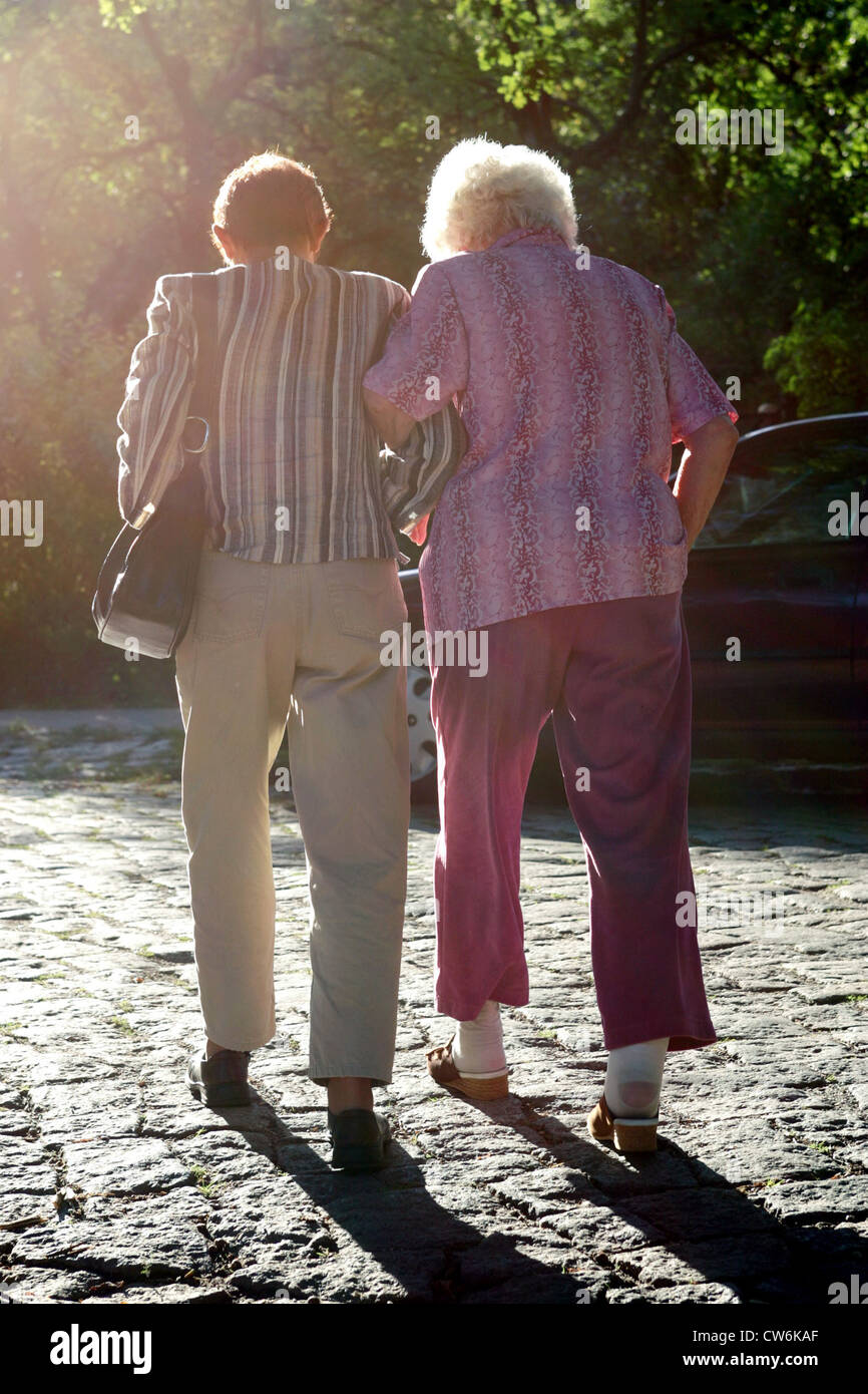 Helping elderly cross street hi-res stock photography and images - Alamy