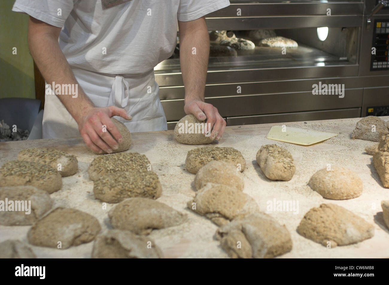 Berlin, baker bakes bread Stock Photo - Alamy