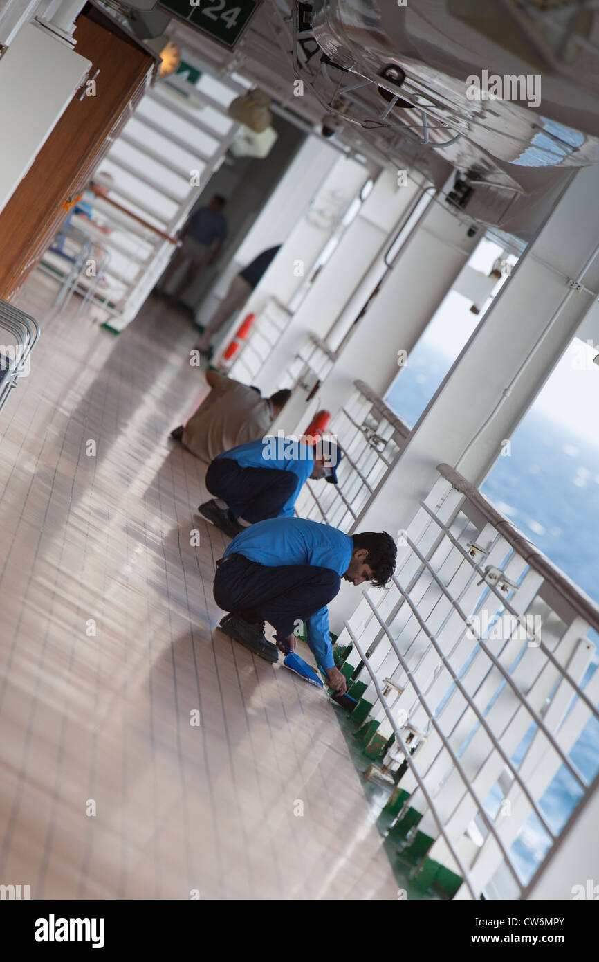 Seamen painting and maintaining appearance of the Prom deck and ...