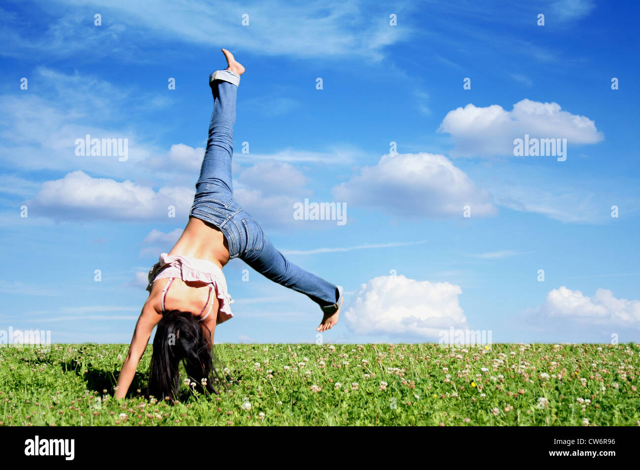 woman doing a cartwheel Stock Photo - Alamy