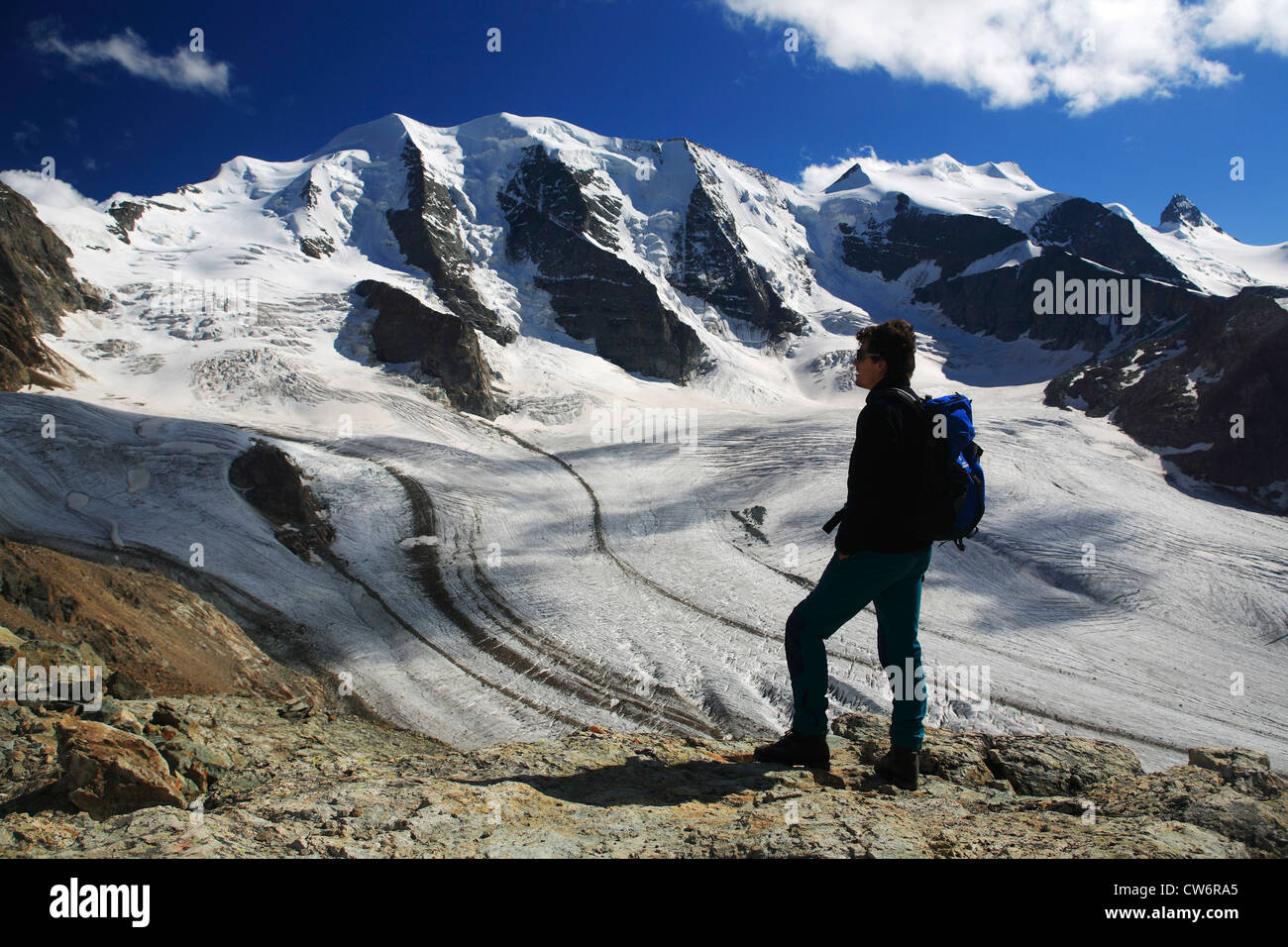 mountain hiker at the Diavolezza on front of Piz Palue, Switzerland ...