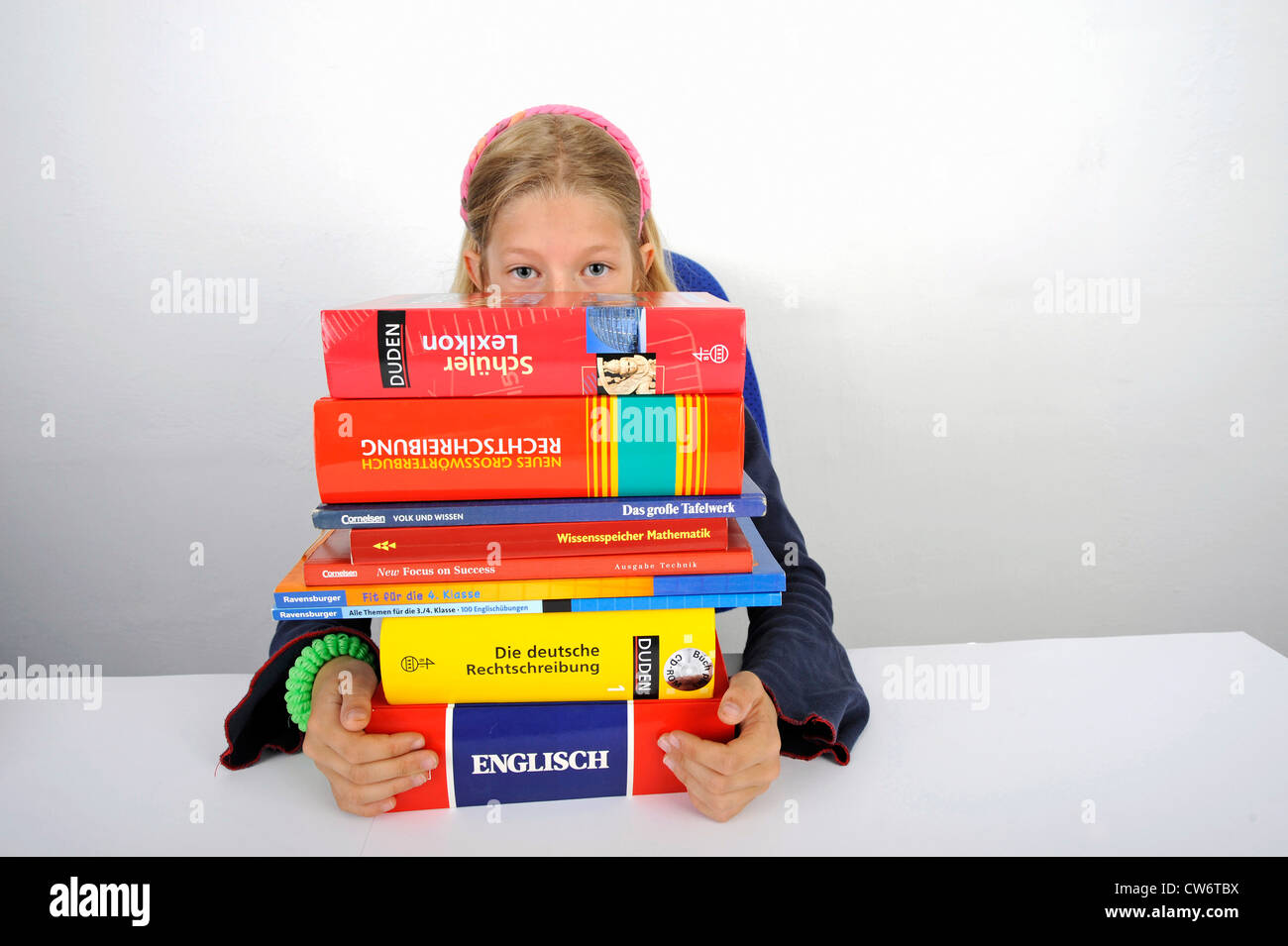 school girl with a stack of school books Stock Photo - Alamy
