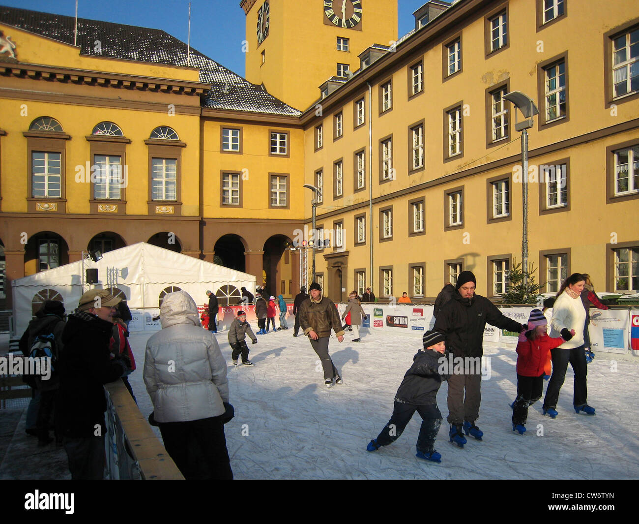 people ice skating on the Christmas market at the town hall, Germany ...