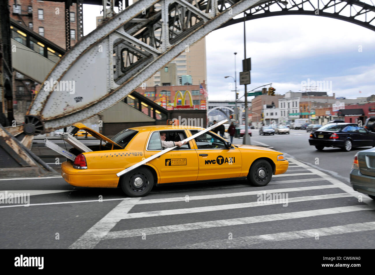 transporting unwieldy materials in a Yellow Cab, USA, New York City ...