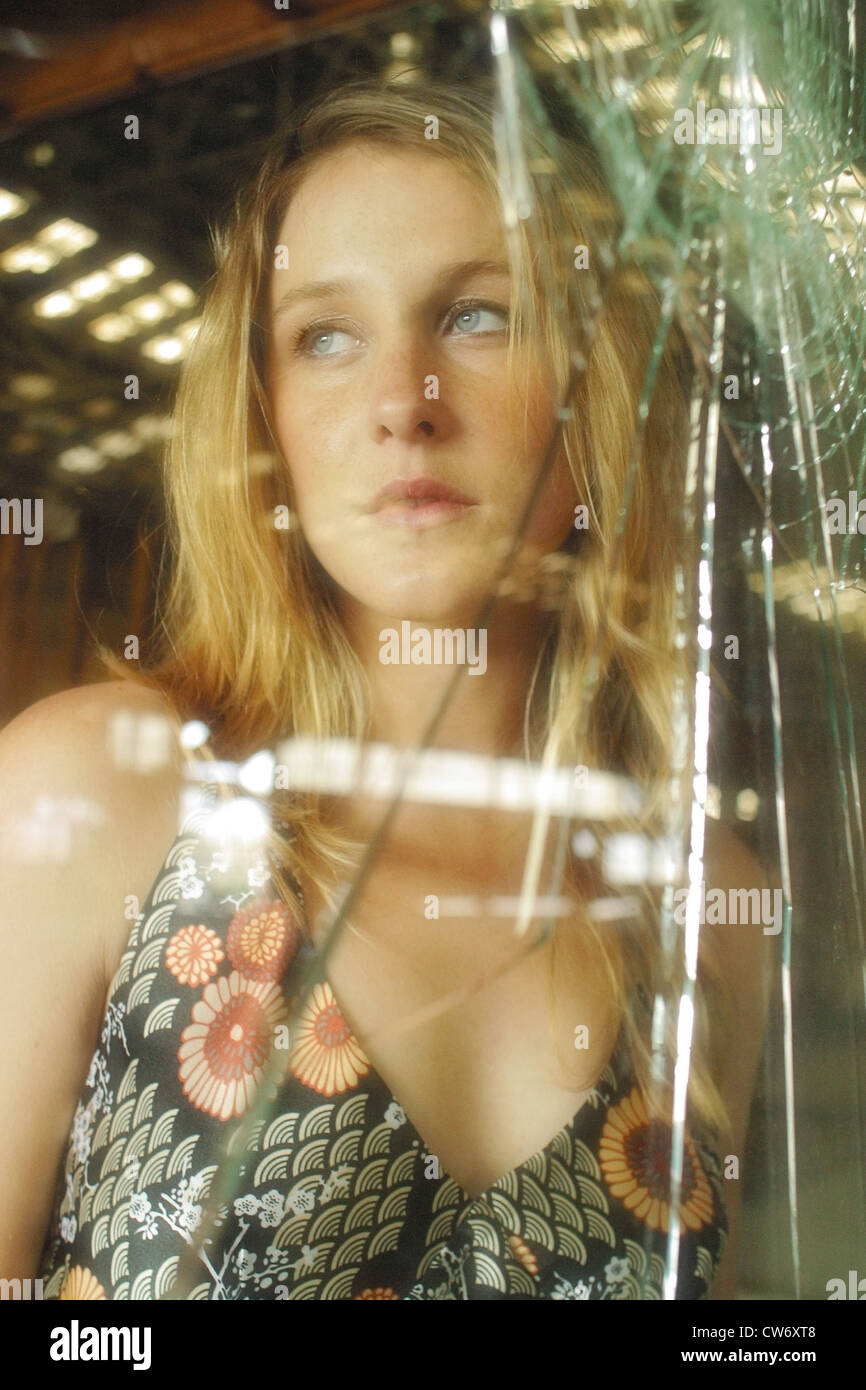 Woman behind broken glass hi-res stock photography and images - Alamy