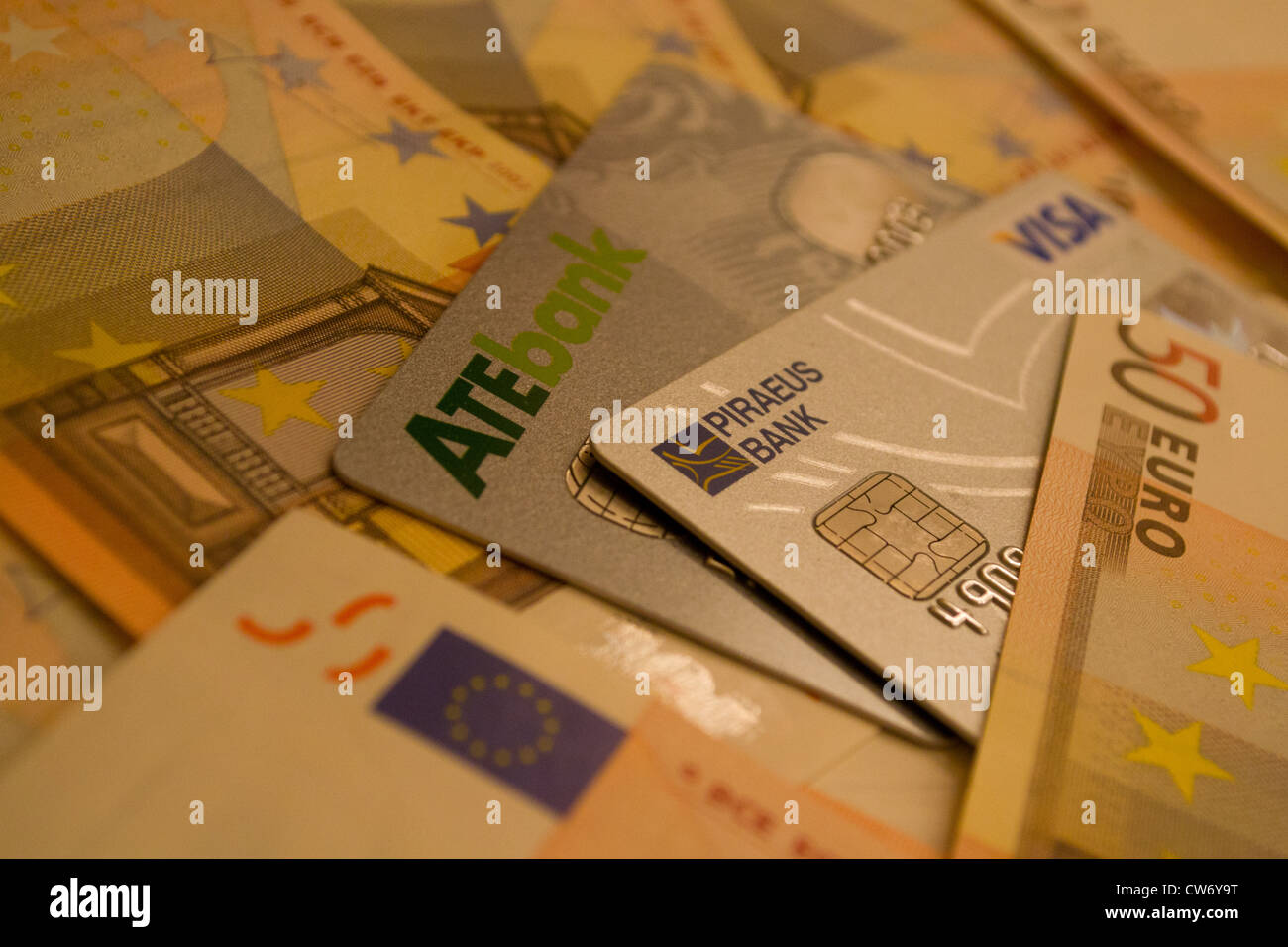 Credit cards in between euro banknotes Stock Photo - Alamy