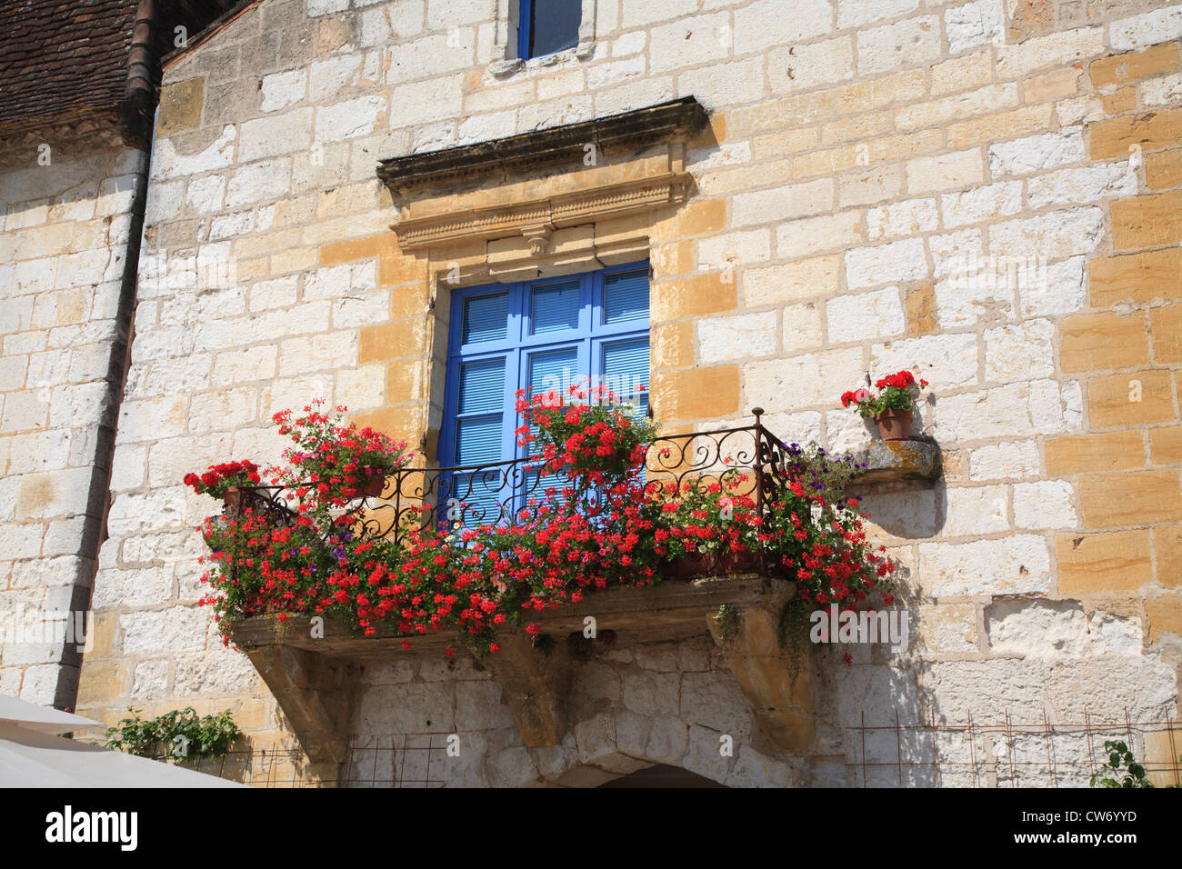 Pelargoniums AKA geraniums growing in pots on a balcony in Monpazier ...