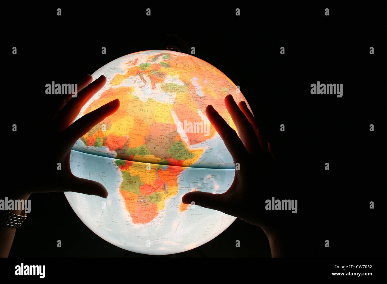 globe and hands Stock Photo - Alamy