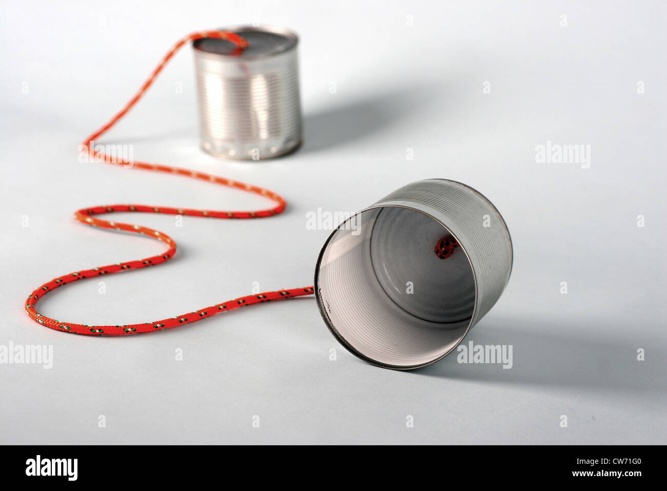 a children's telephone made of a rope connecting two tin cans Stock ...
