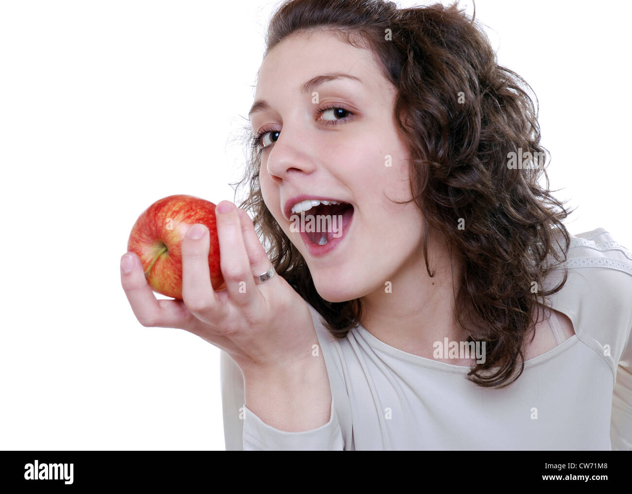 Woman wants to bite into an apple Stock Photo - Alamy