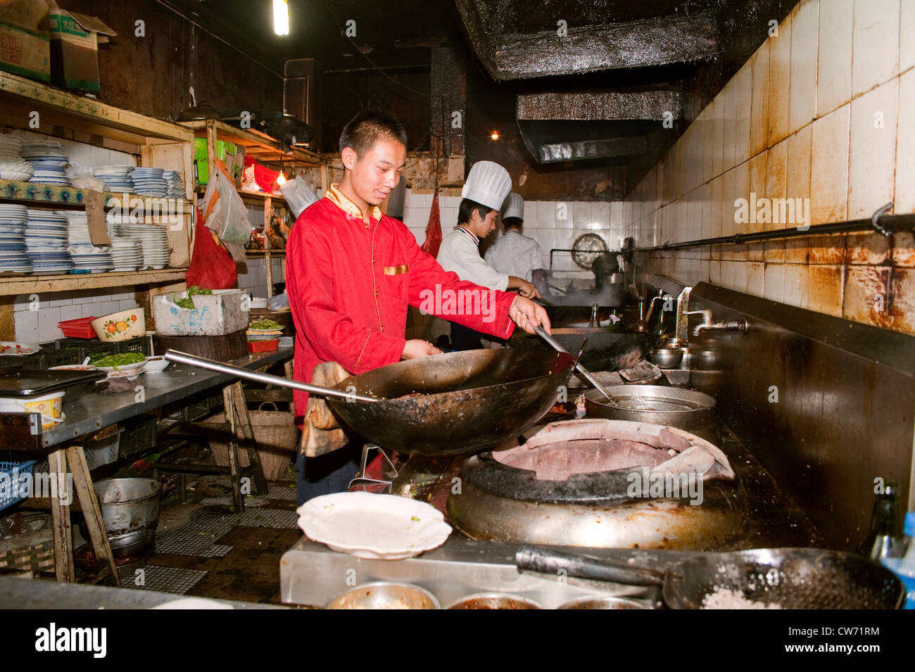 chinese cooks cooking in kitchen, China Stock Photo - Alamy