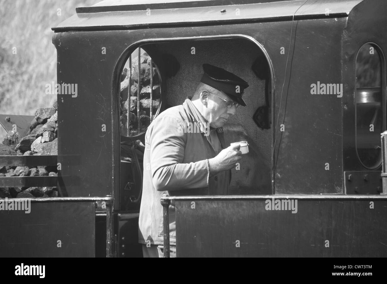 Great Central Railway Train Driver with Tea Mug Stock Photo - Alamy