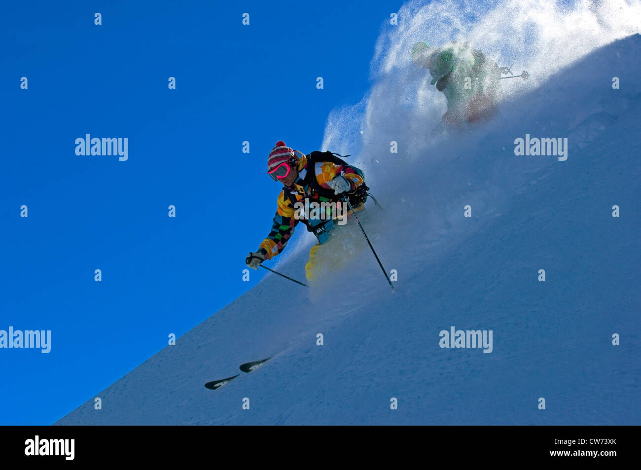 two skier at the run in deep powder snow, France Stock Photo - Alamy