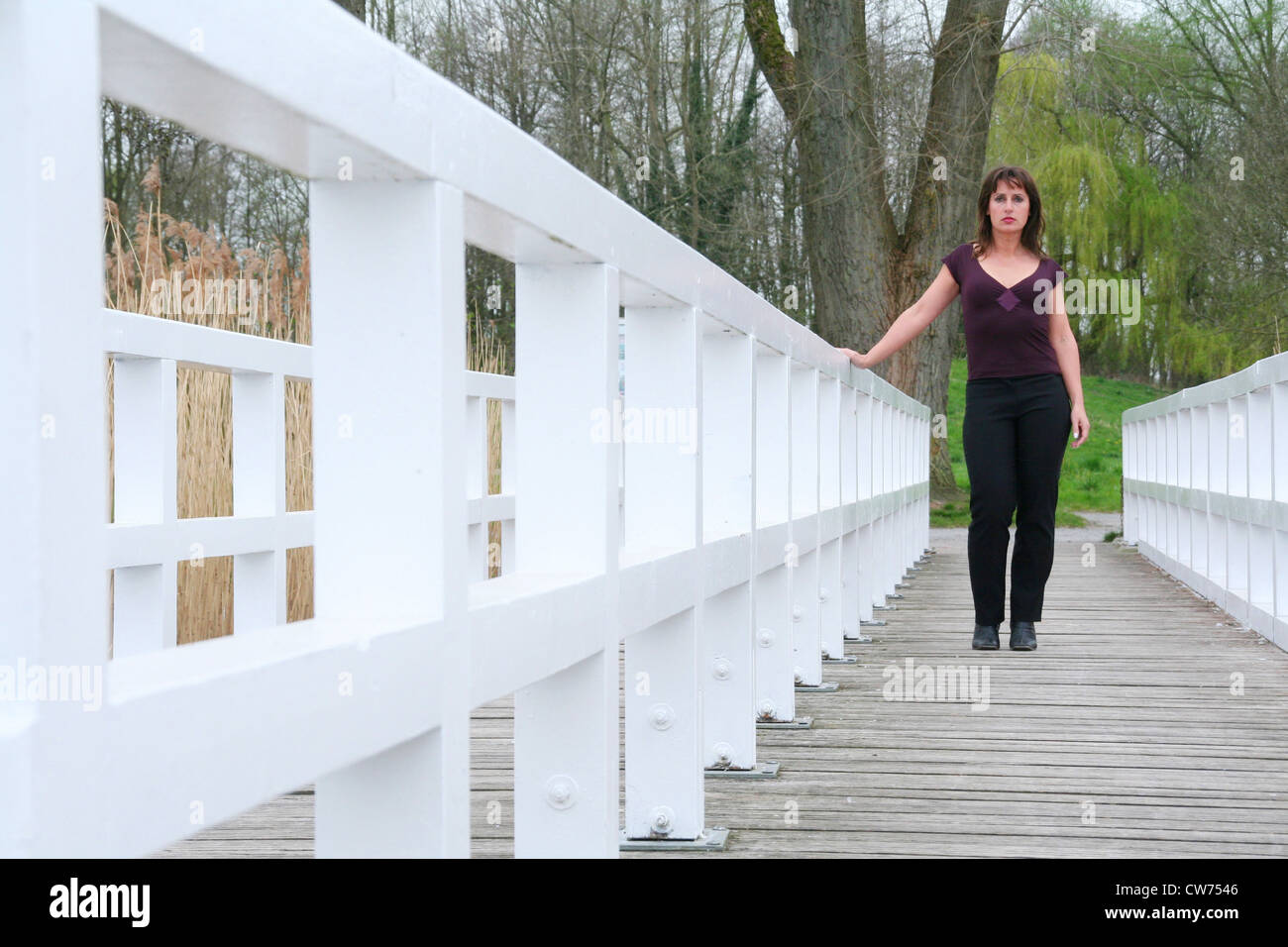 middle-aged woman on a landing stage Stock Photo - Alamy