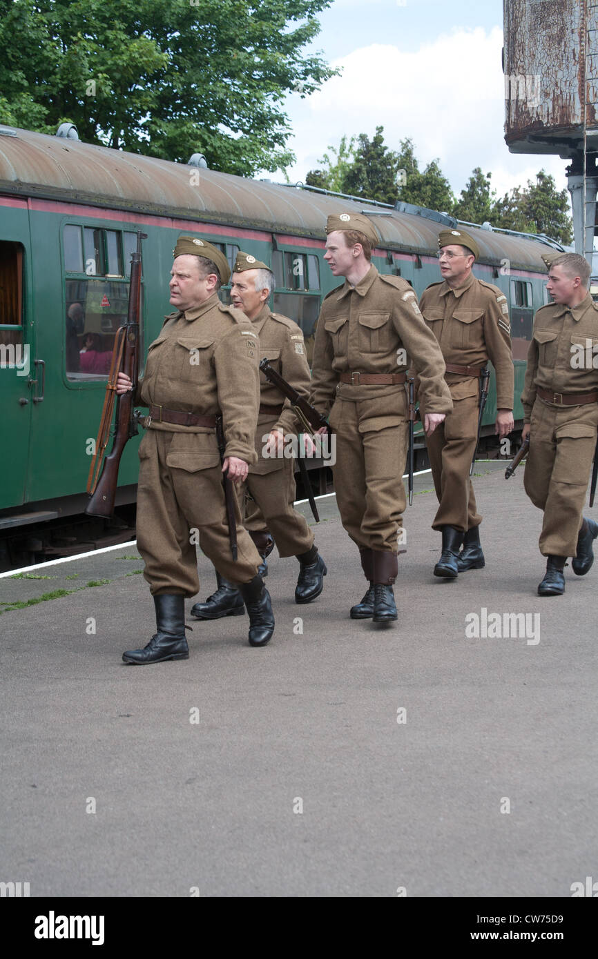 Home Guard on platform with train Stock Photo - Alamy