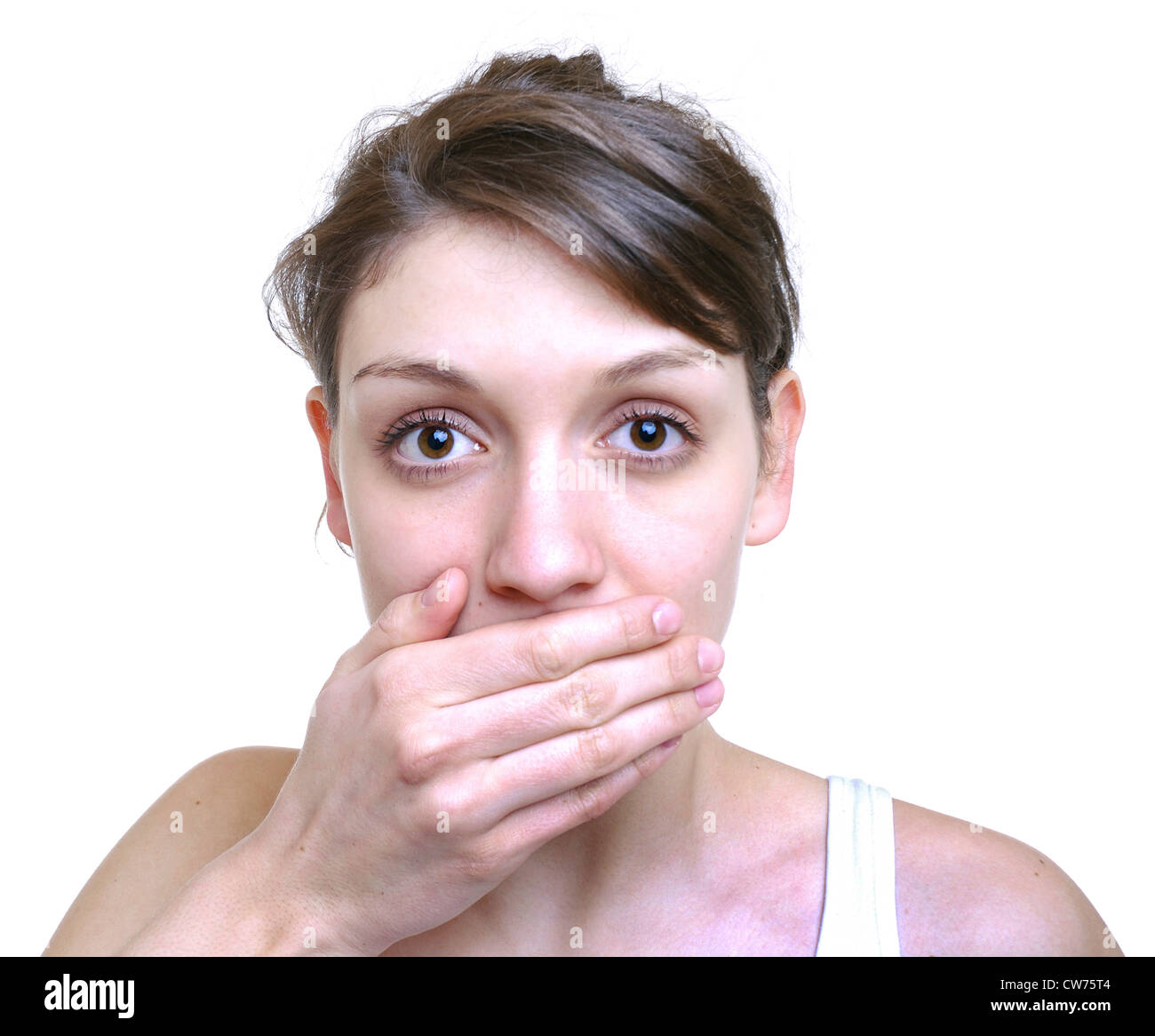 Young woman holds the hand to the mouth on hi-res stock photography and ...