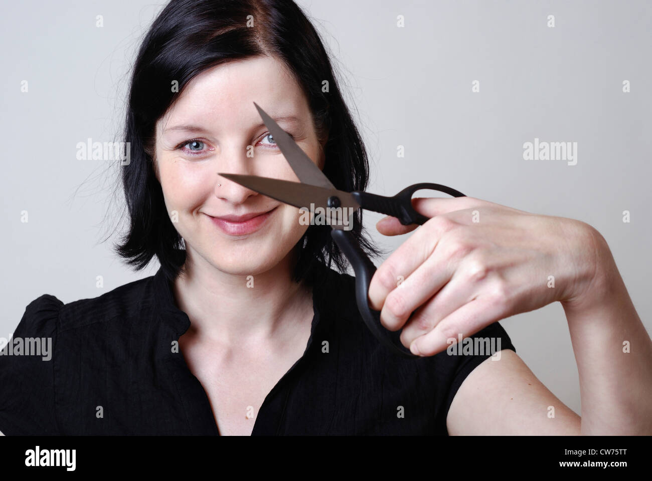 Woman handles with a cutter Stock Photo - Alamy