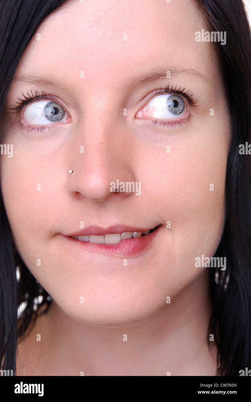 Woman looks sceptical Stock Photo - Alamy
