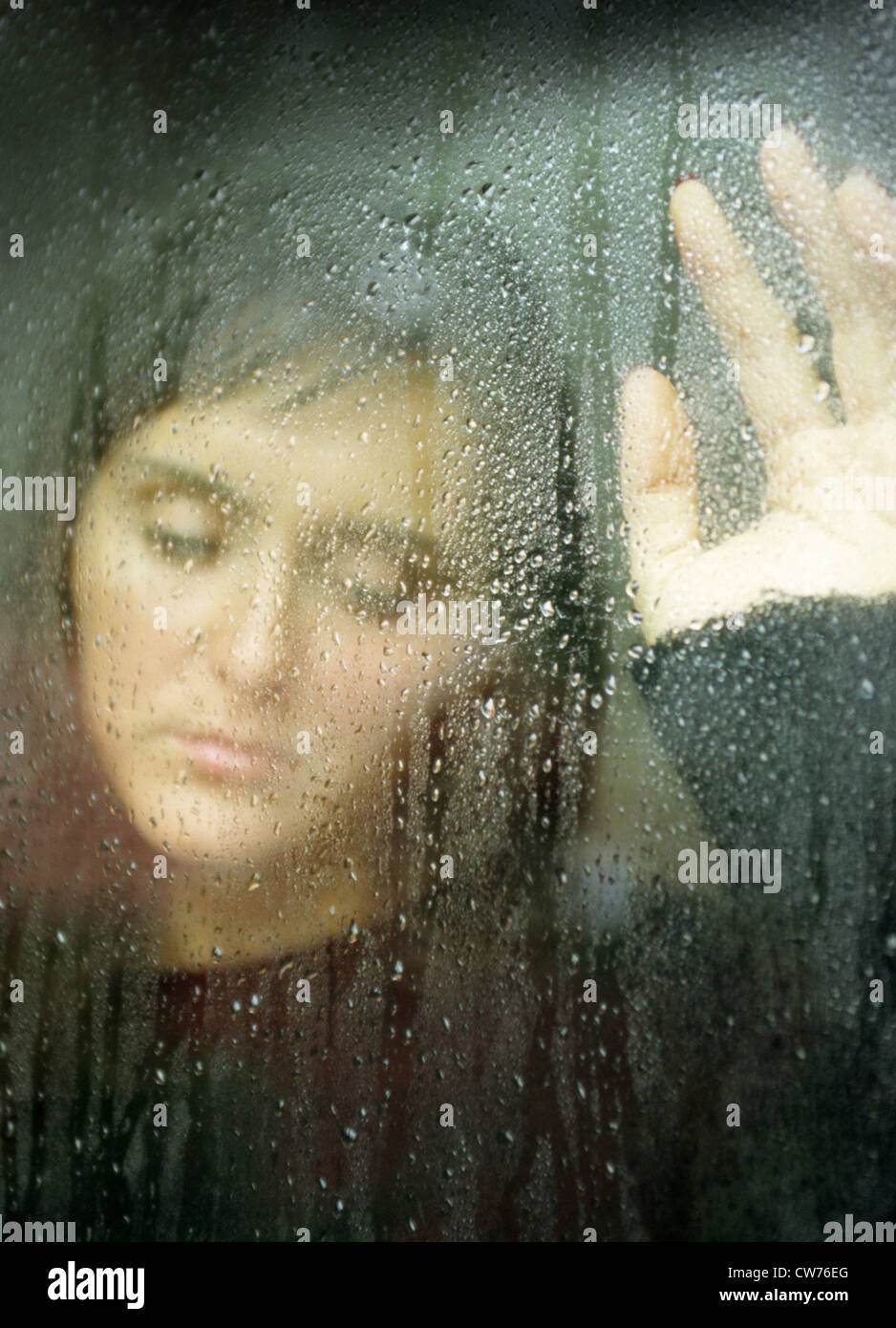 Woman face window rain drops hi-res stock photography and images - Alamy