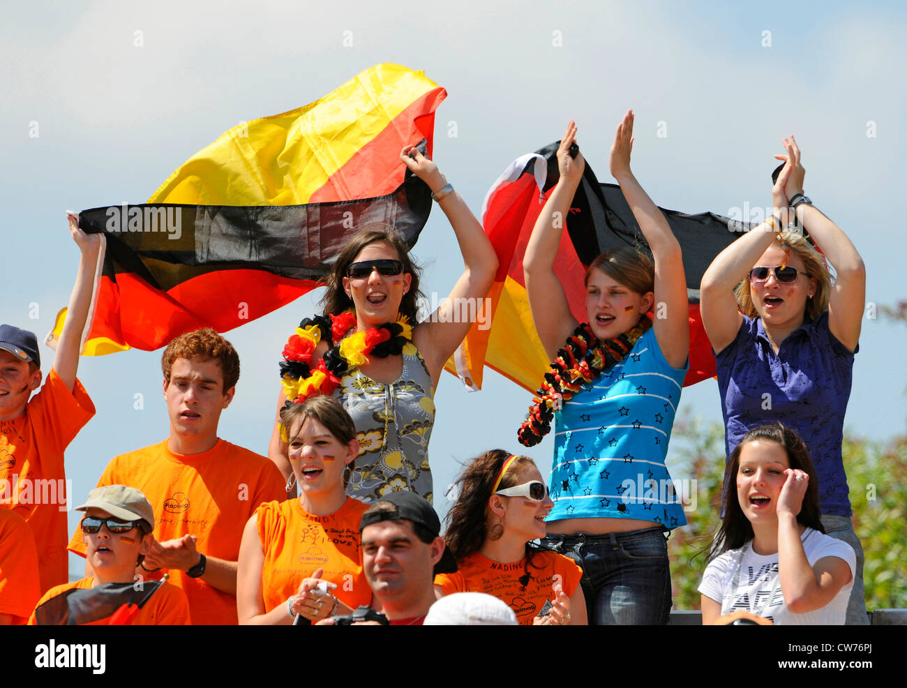 fans in orange Stock Photo - Alamy