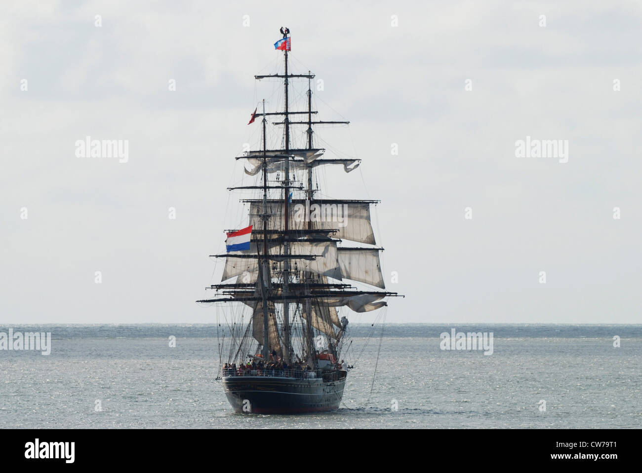 Two sailors sitting on mast top of tall ship hi-res stock photography ...