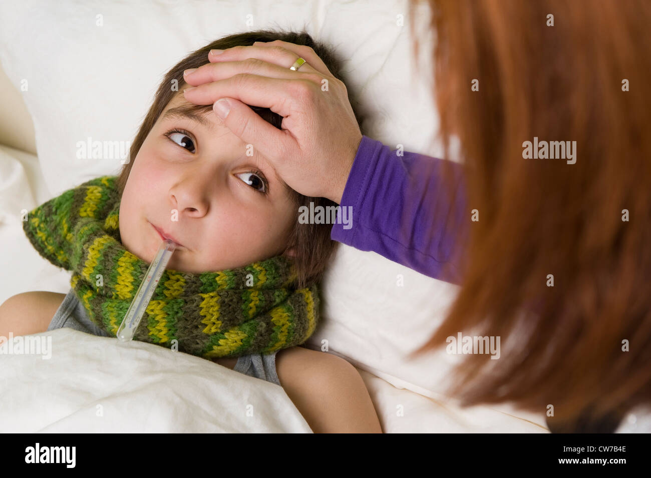 mother with her sick at the bed Stock Photo - Alamy