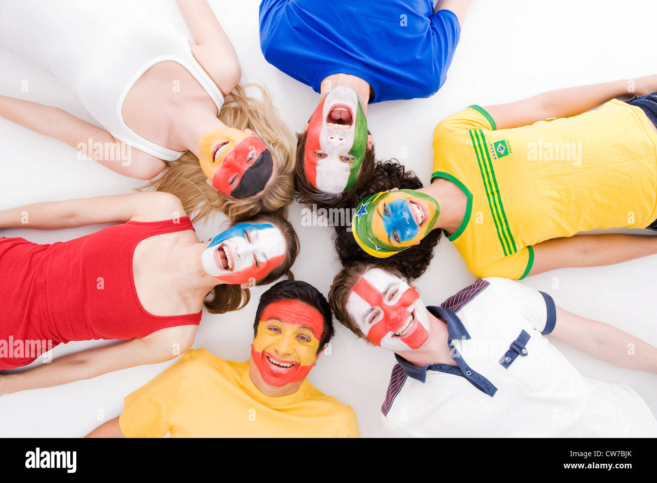 international young people with painted faces in national colours Stock ...