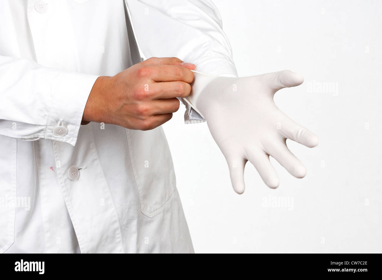 doctor pulling rubber gloves, Germany Stock Photo - Alamy