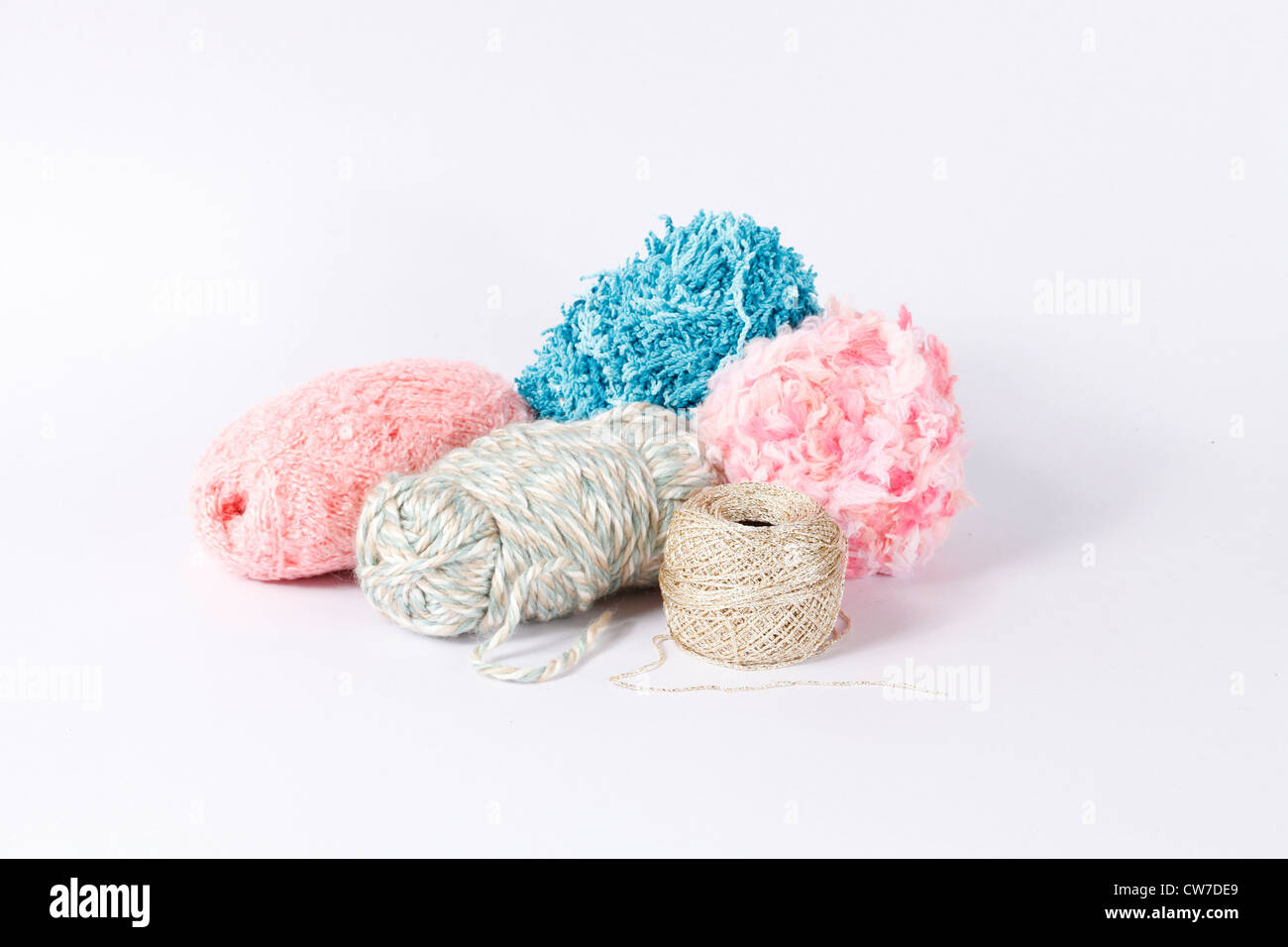 Pile of balls of colorful craft yarn on white background Stock Photo ...