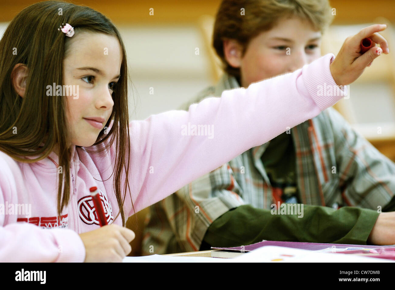 Girl is answering in the class education Stock Photo - Alamy