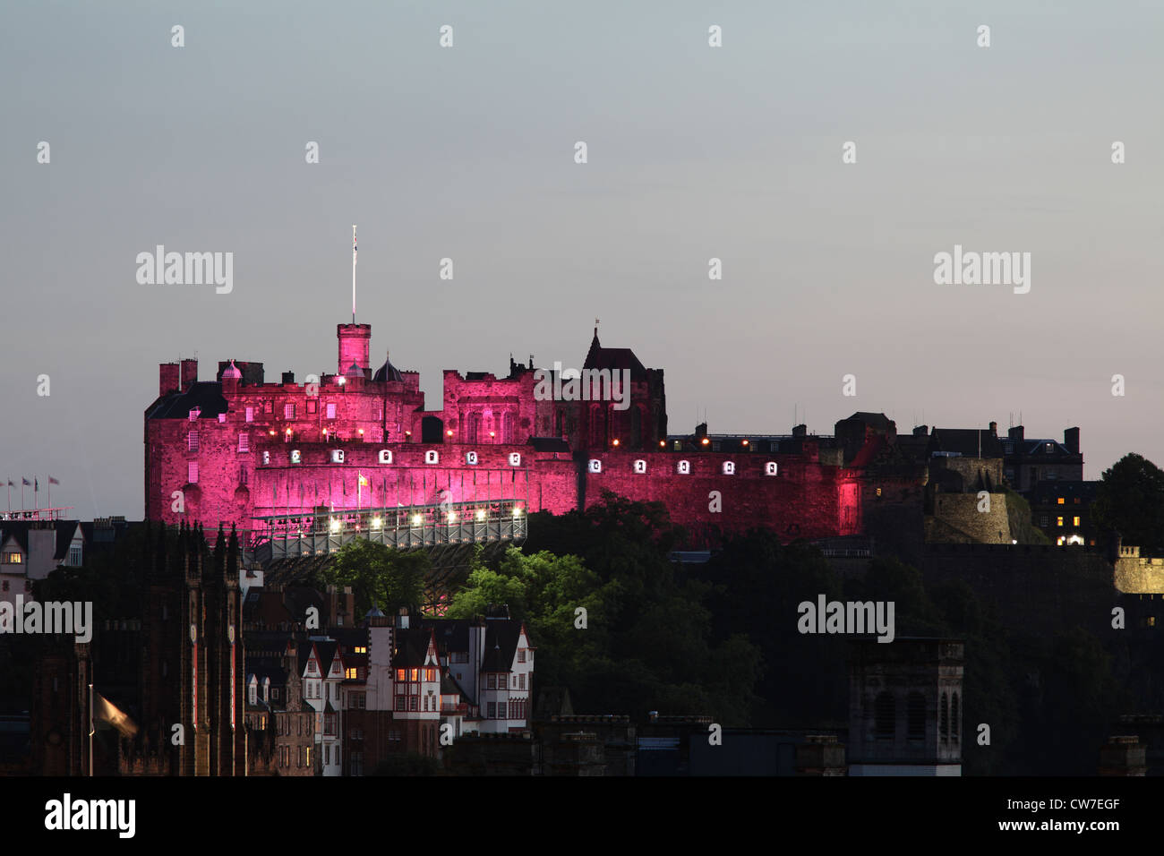 Edinburgh Castle illuminated pink at dusk, Scotland UK Stock Photo - Alamy
