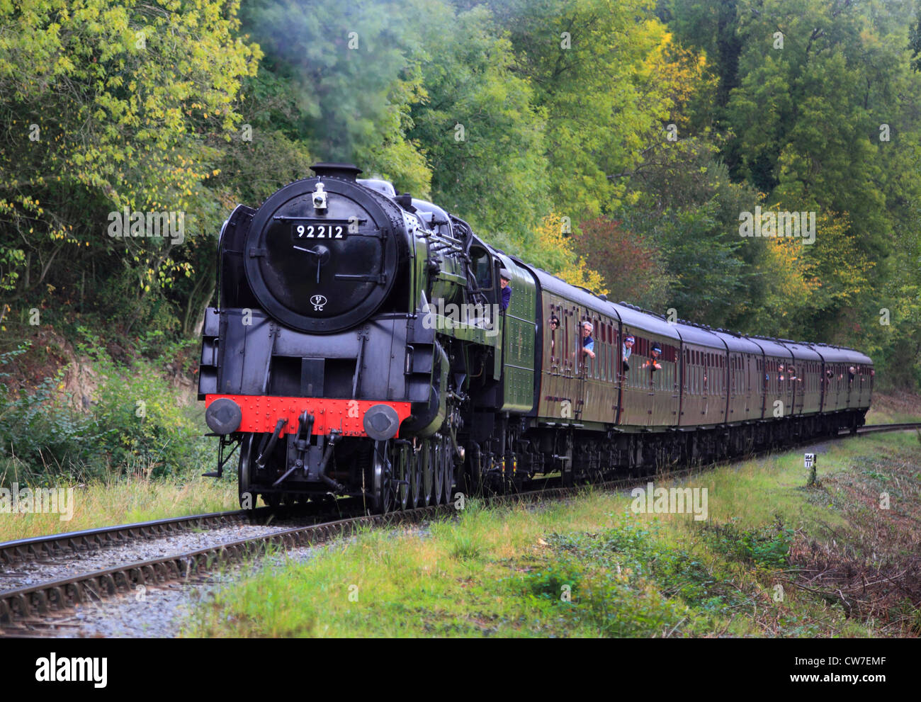 British Railways 9F, 2-10-0, No.92212 hauls a passenger train towards ...