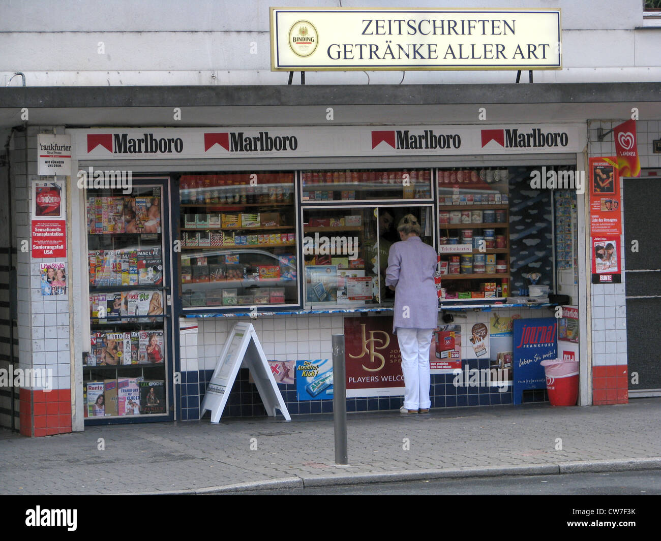 Female client at a small shop in the city centre of Frankfurt, Germany ...