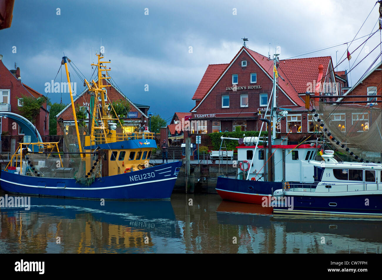 evening mood over fishing trawlers in the harbour, Germany, Lower ...